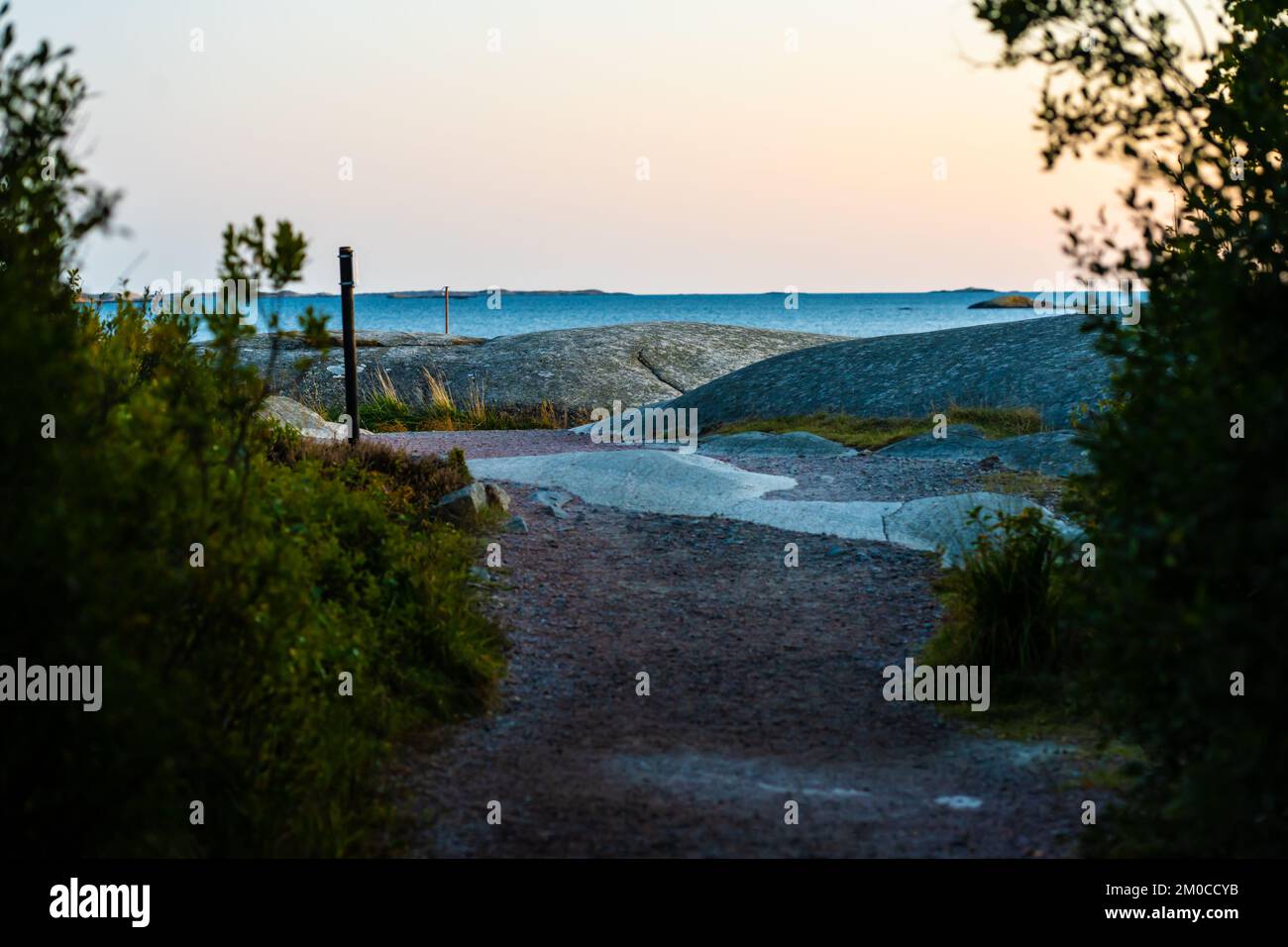 Rounded cliffs by the sea at late night Stock Photo - Alamy