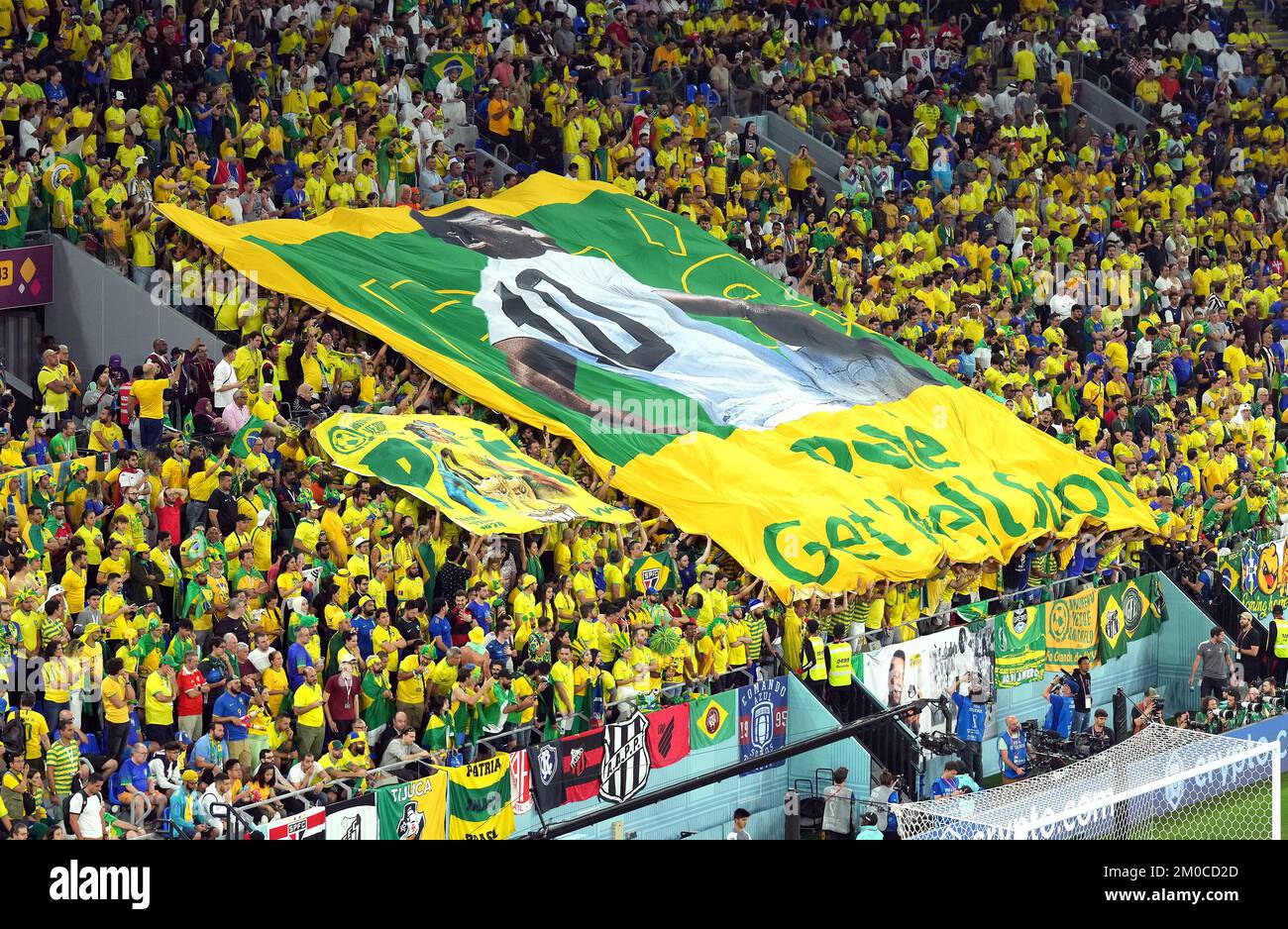 A large flag featuring former Brazil player Pele saying 'Get well soon ...