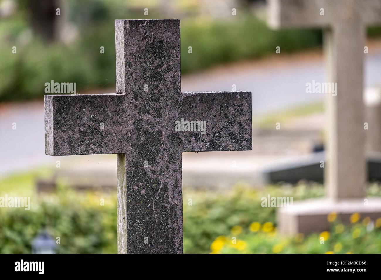 Stone cross on a graveyard in autumn Stock Photo - Alamy