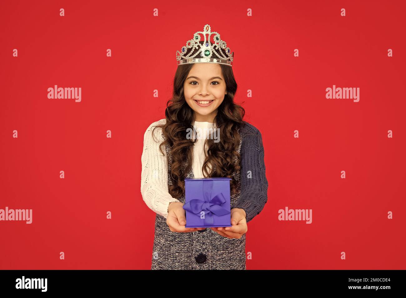 smiling child in queen crown. princess in tiara hold box. kid with ...