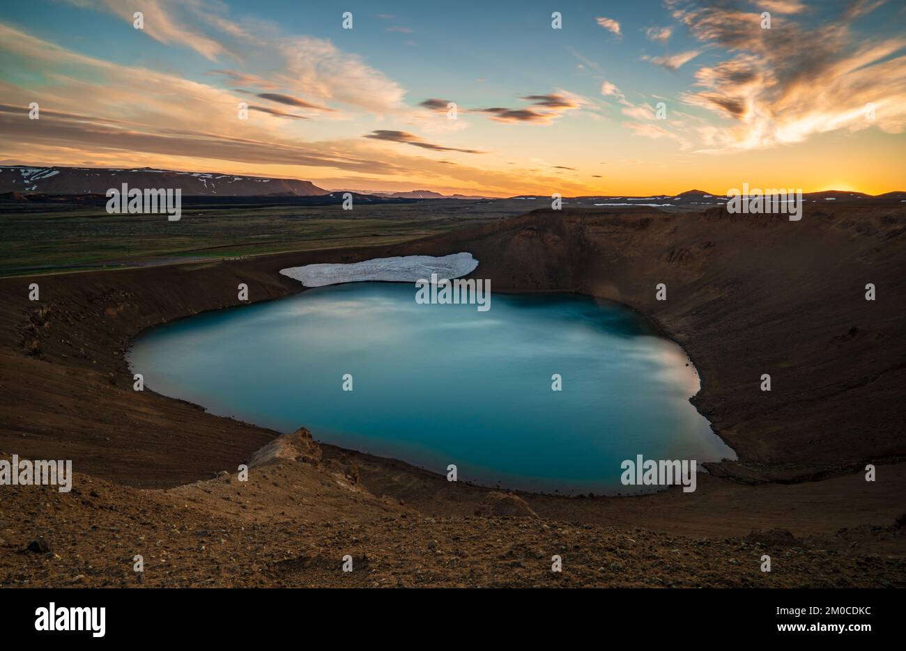 An aerial shot of a Krafla crater in North Iceland on a summer night ...