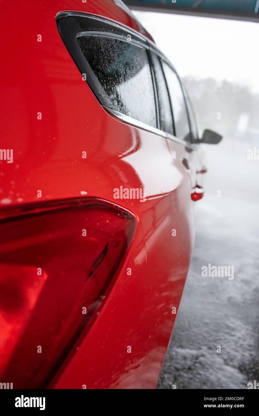 Side of a red car being washed Stock Photo - Alamy