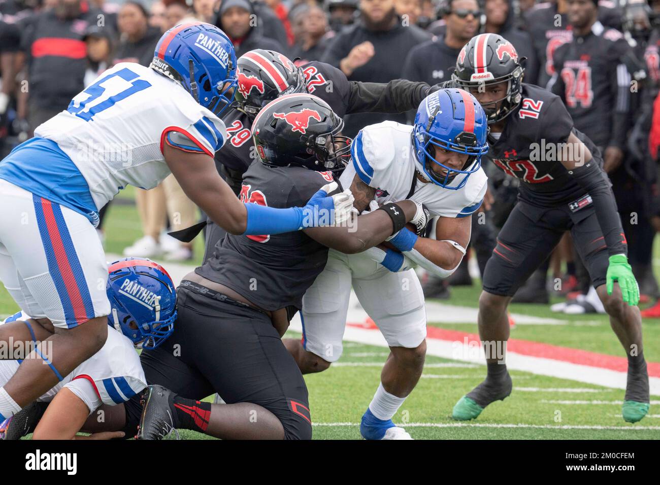 Georgetown Texas USA, December 3 2022: Defensive players tackle ball ...