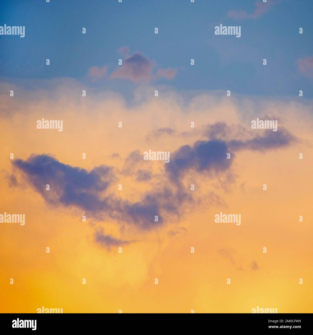 Semi abstract impressionistic colour photograph of cloudscapes backlit ...