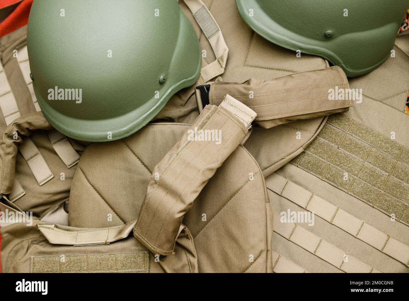 Top view of two body armor and helmets Stock Photo - Alamy