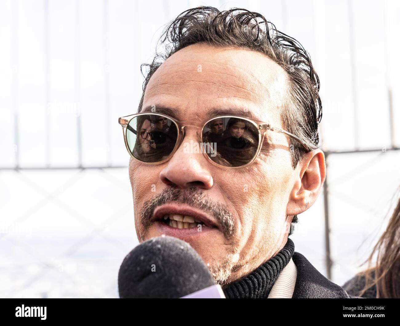 Marc Anthony speaks to press on observation deck during visit to Empire ...