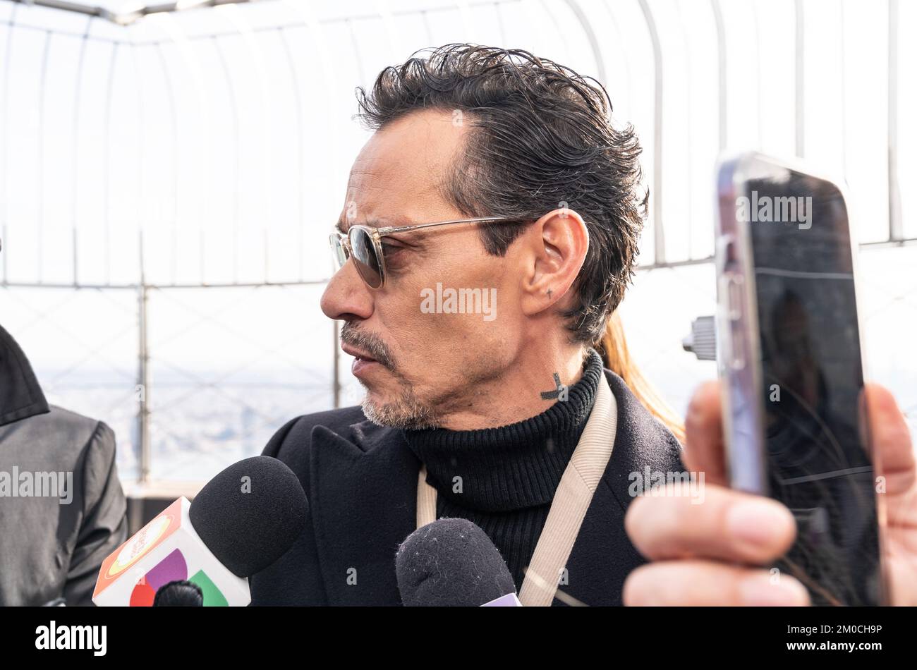 Marc Anthony speaks to press on observation deck during visit to Empire ...