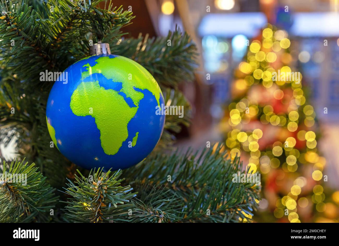 Globe-shaped Christmas ball with countries and continents on the ...