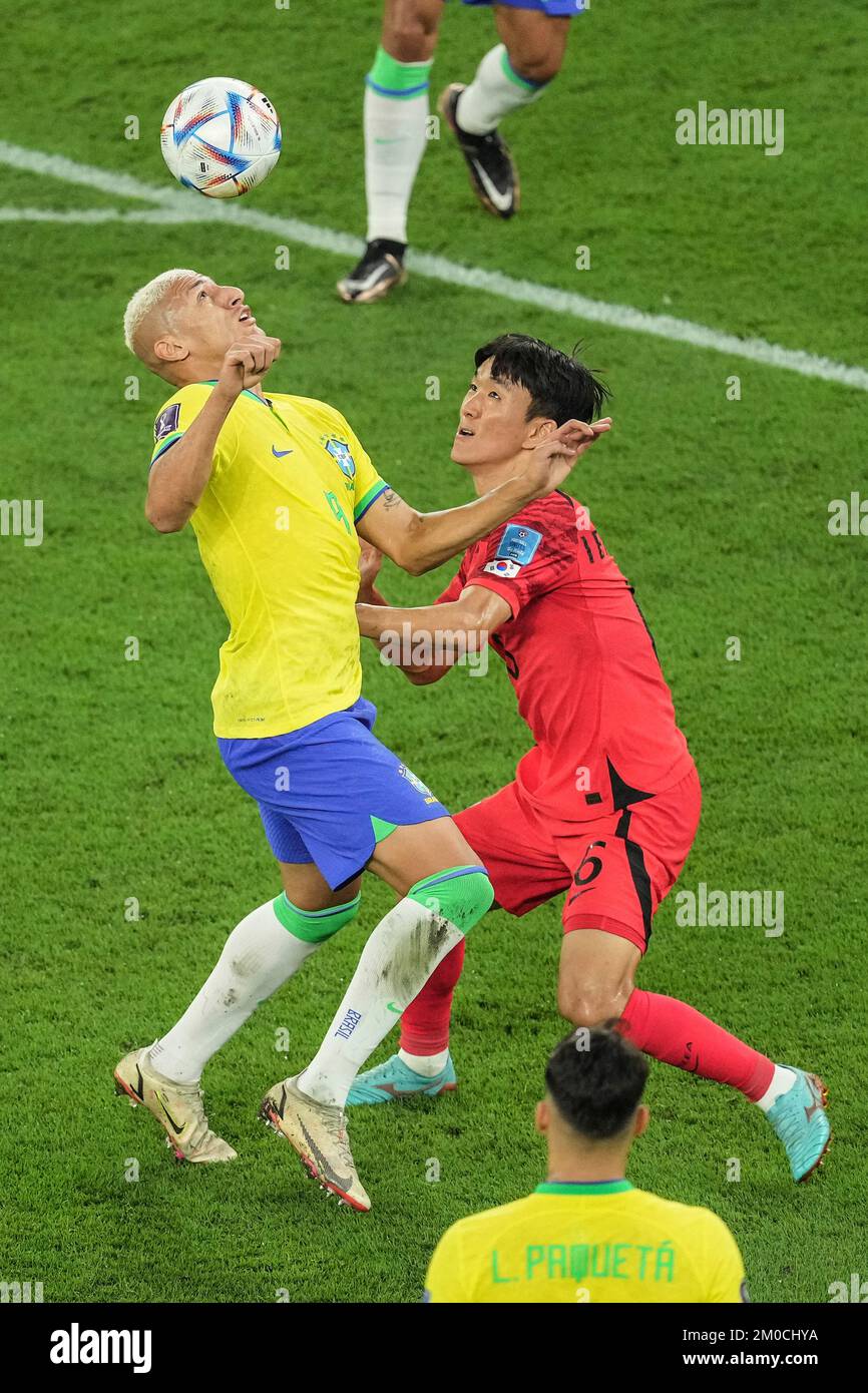 Doha, Qatar. 5th Dec, 2022. Hwang In-beom (R) of South Korea vies with ...
