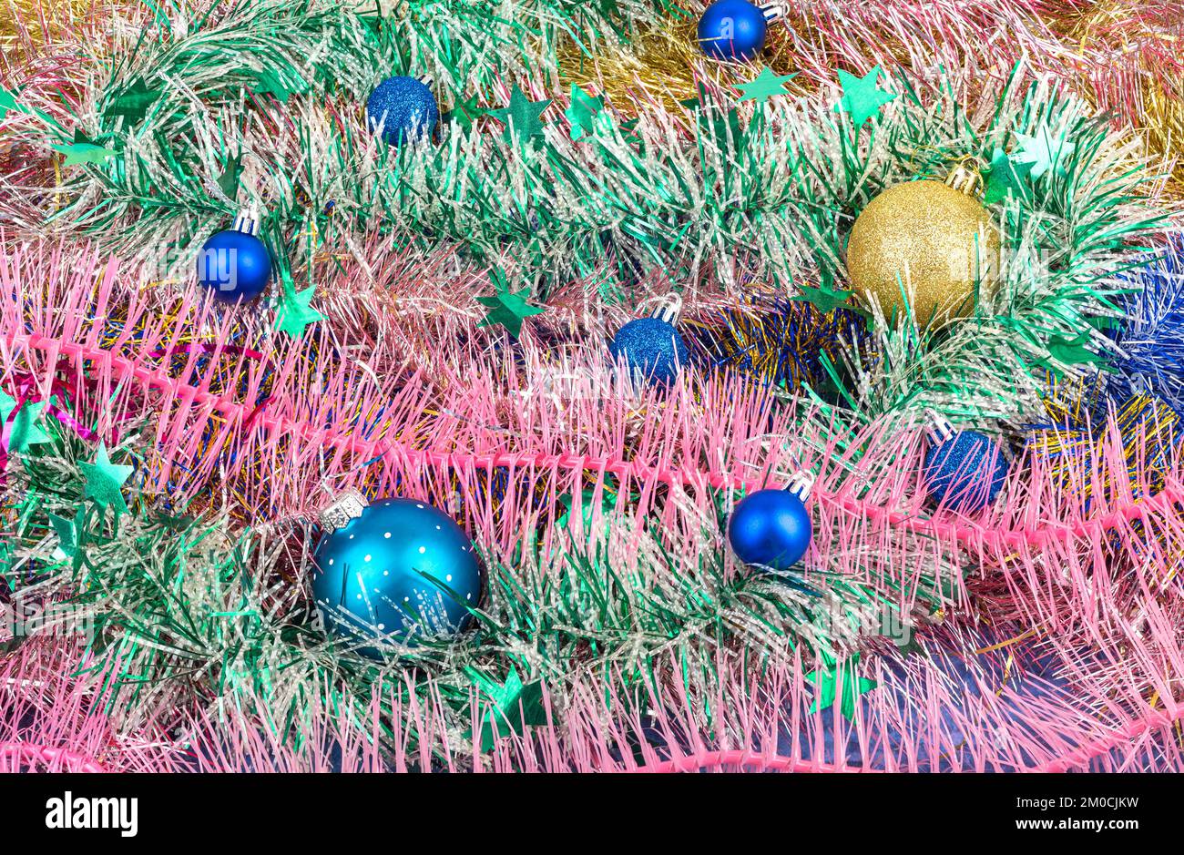 Tinsel of different colors and Christmas balls. New Year's tinsel ...