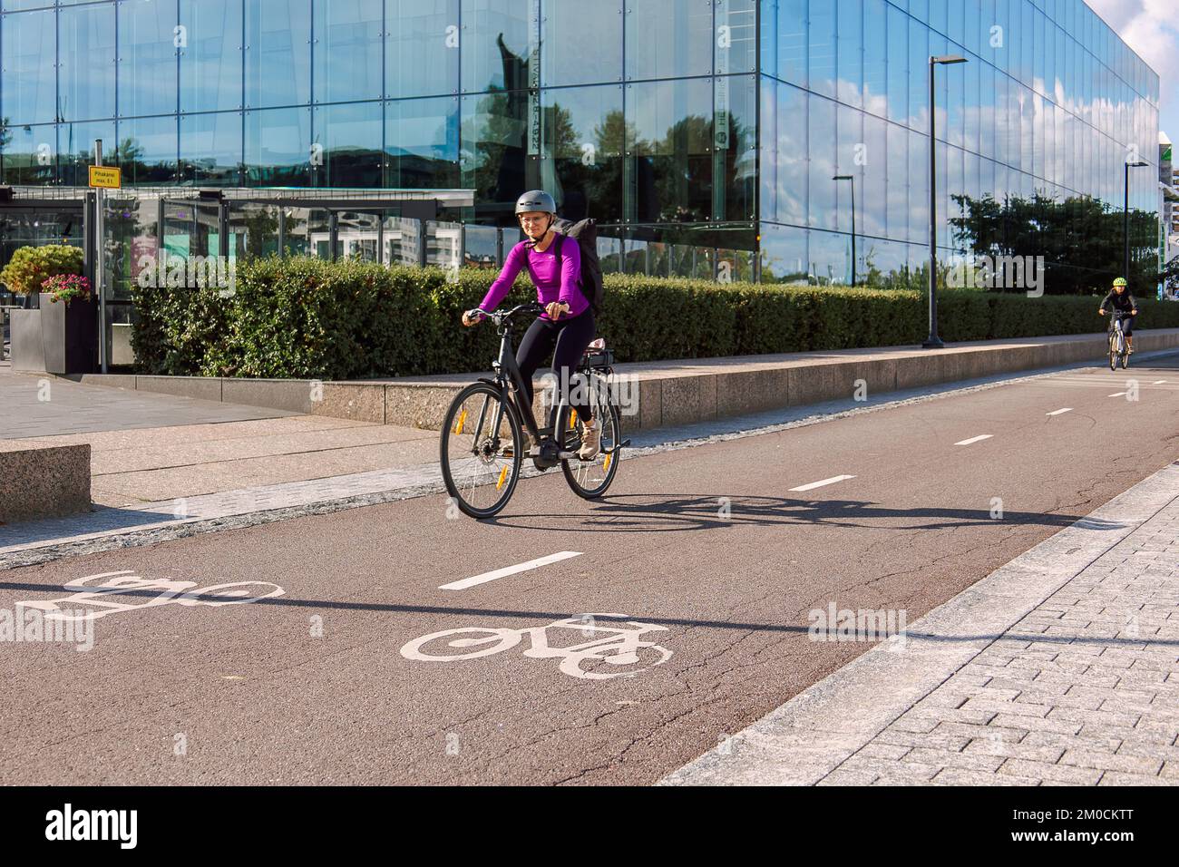 Helsinki, Finland - August 22, 2022: Cyclists in protective helmets ...