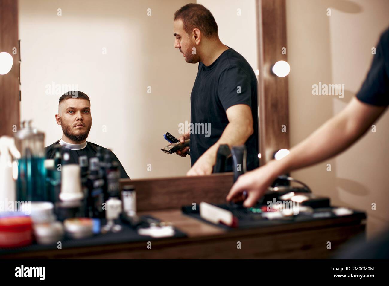 Barber shaving caucasian man in barber shop Stock Photo - Alamy