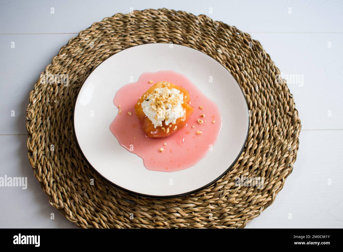 Traditional Turkish quince dessert, quince is cooked in water with ...