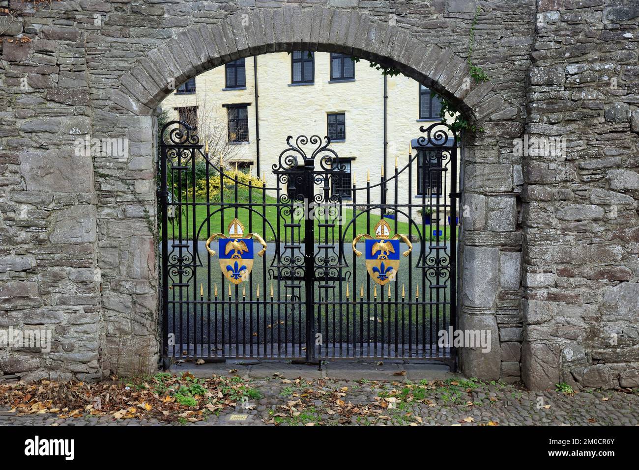 Decorative wrought iron gate to Brecon Cathedral. Brecon, Powys, Wales ...
