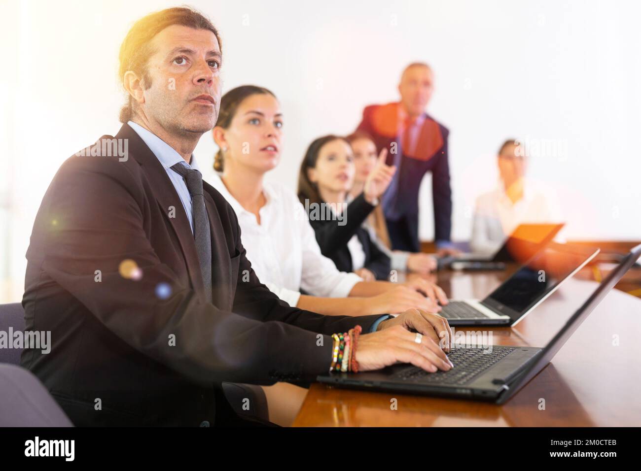 Focused man listening to lecture at conference in meeting room Stock ...
