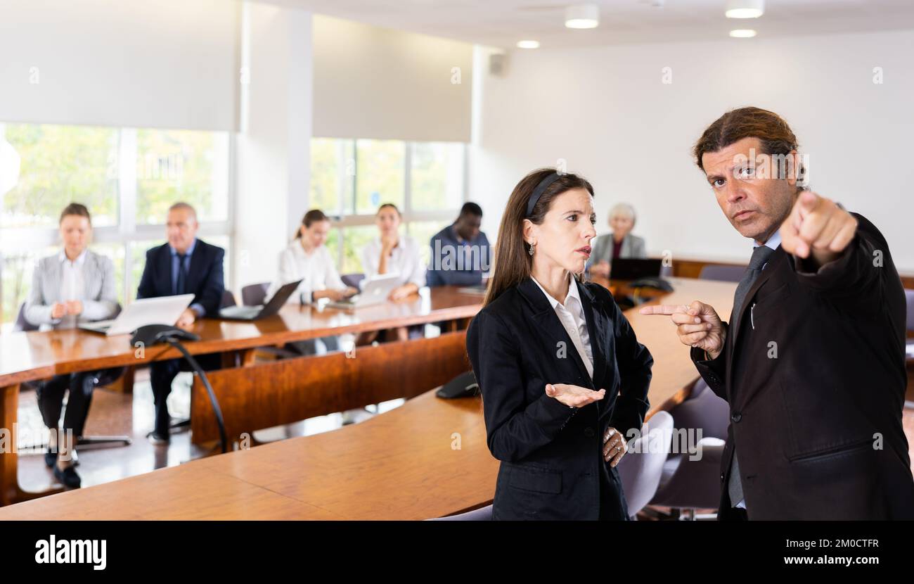 Angry employer firing woman during business meeting Stock Photo - Alamy