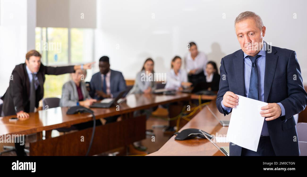 Upset late-middle-aged white male employee getting fired Stock Photo ...