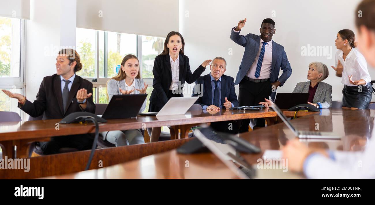 Group of business people arguing in meeting room Stock Photo - Alamy
