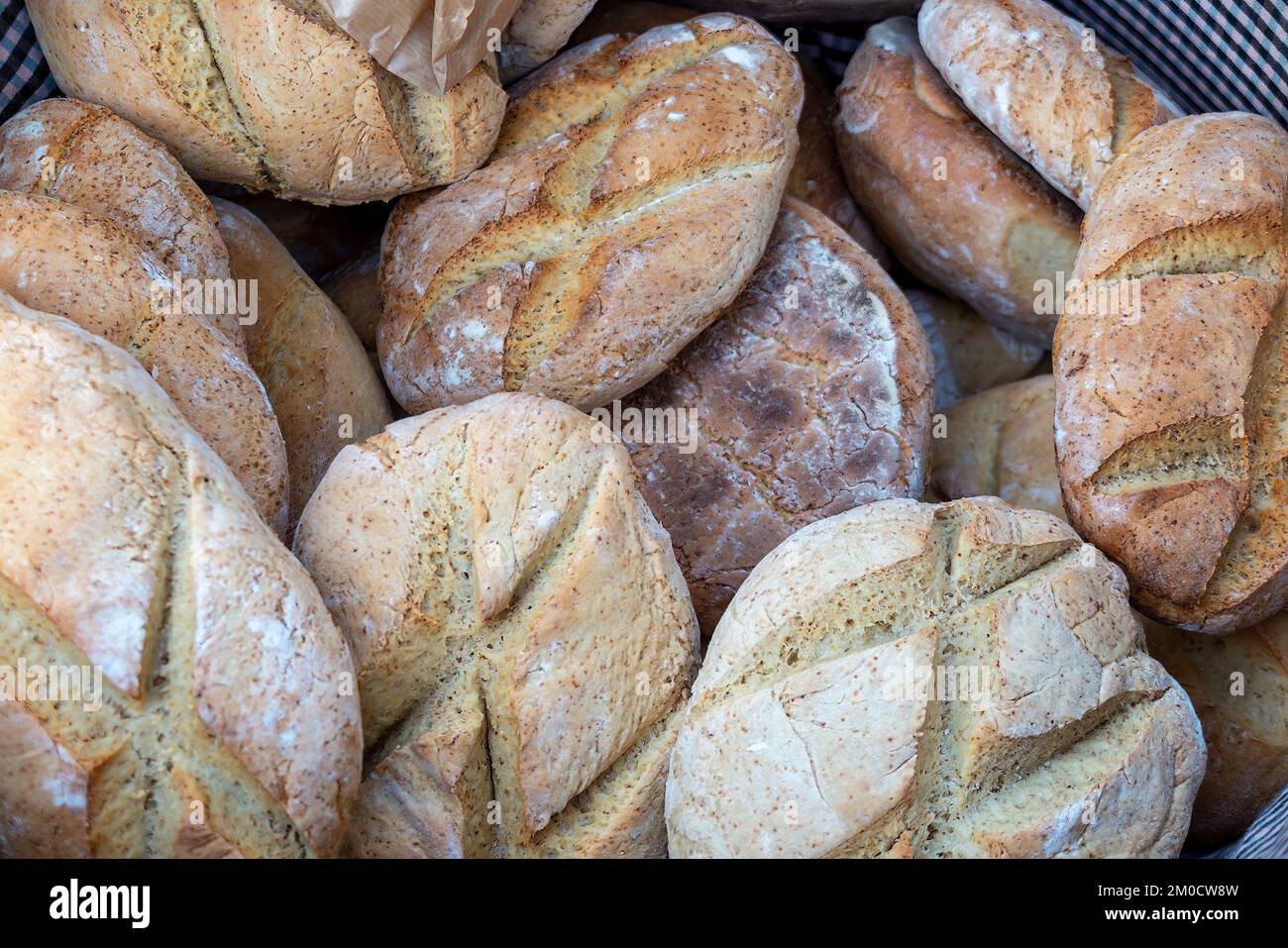 horizontal view of freshly baked loaves of bread made in an artisan way ...