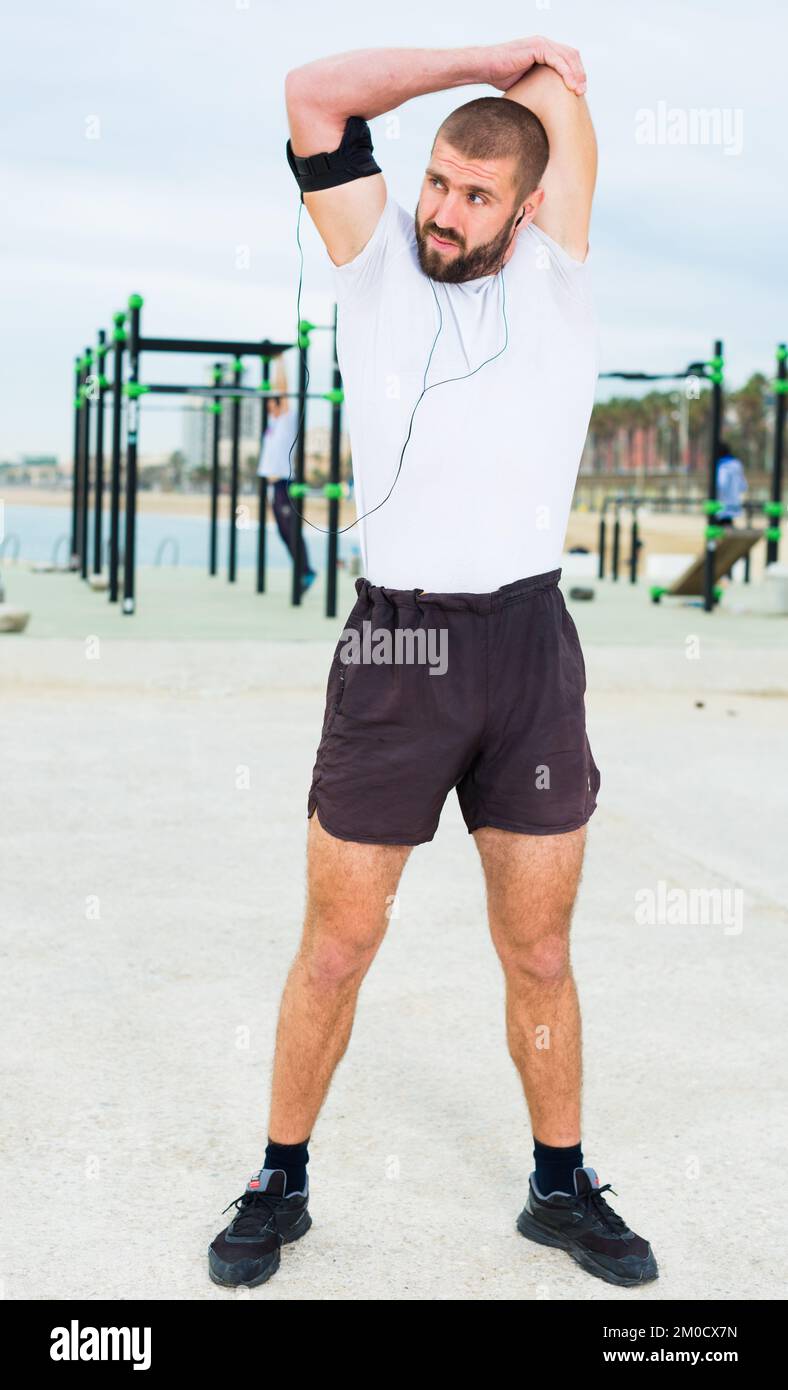 Warming up young man Stock Photo - Alamy