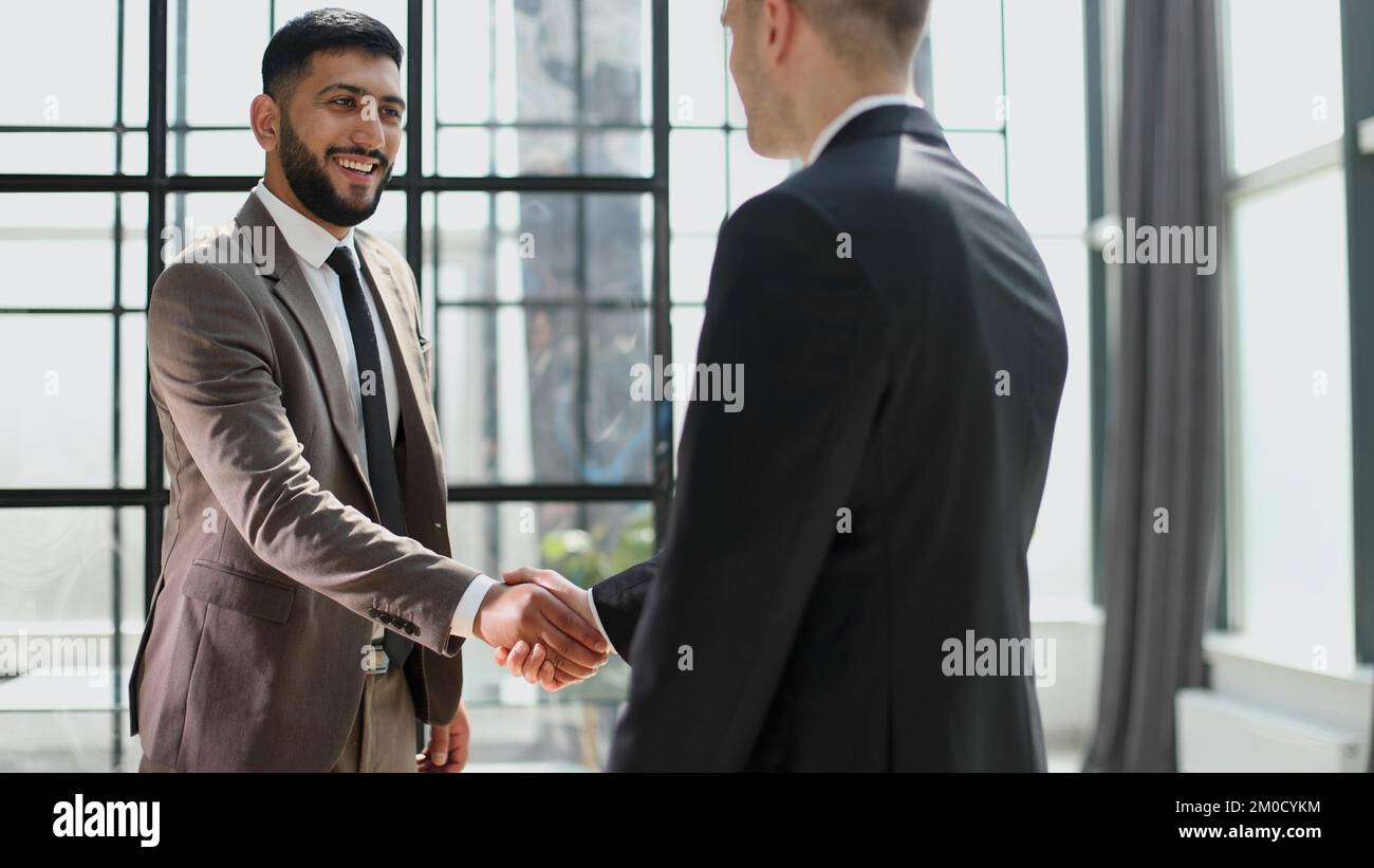 Business shaking hands, finishing up meeting. Successful businessmen ...