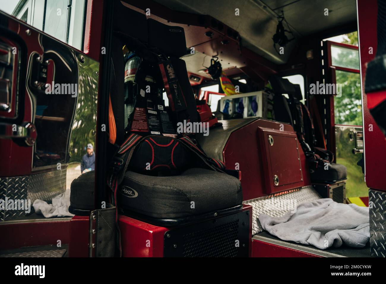 The side view of equipment packed neatly inside a fire engine, fire ...