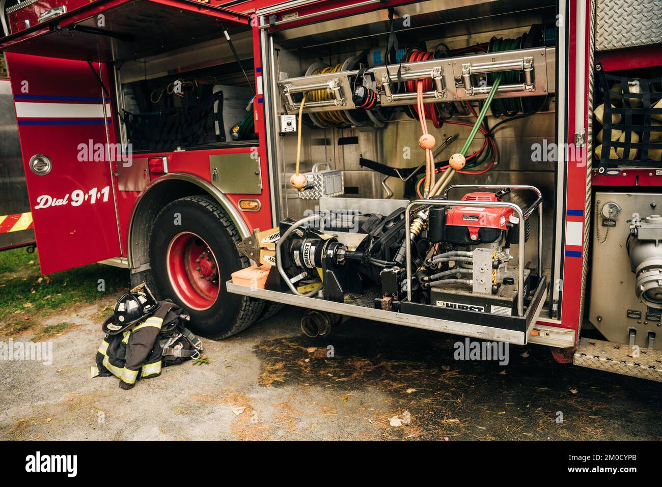 The side view of equipment packed neatly inside a fire engine, fire ...