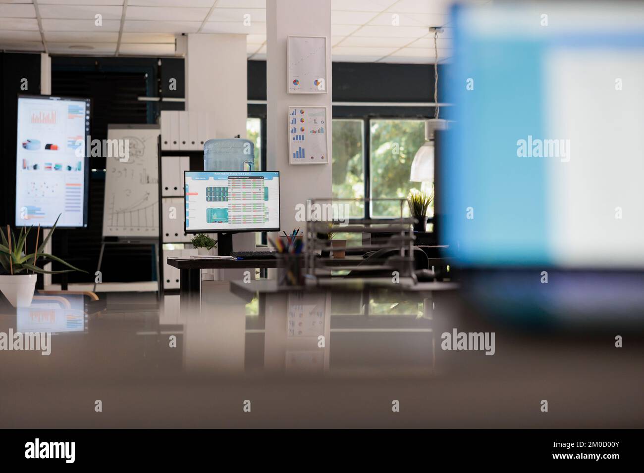 Electronic device screen in meeting room with presentation of results ...