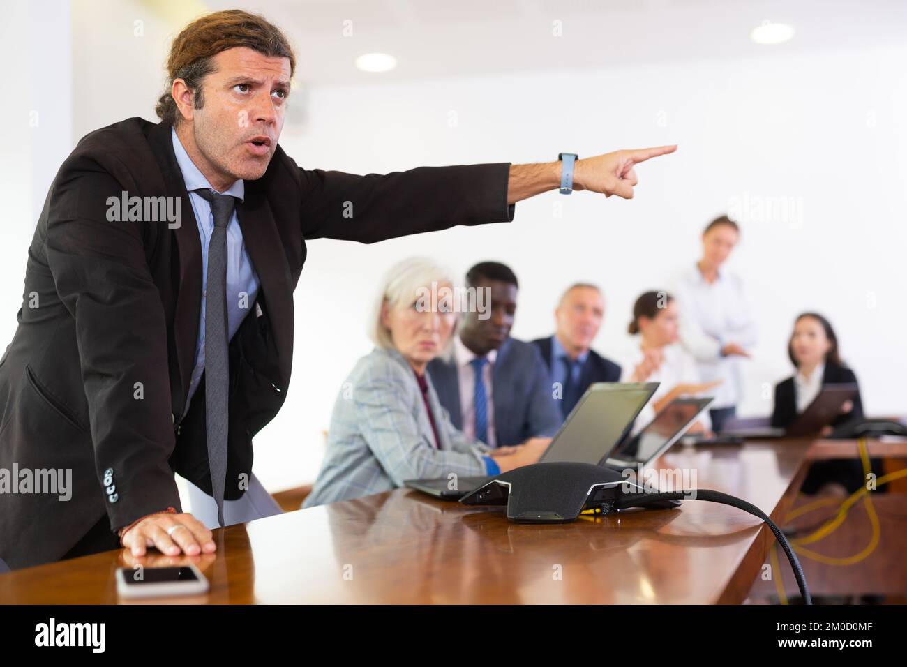 Man pointing exit door hi-res stock photography and images - Alamy