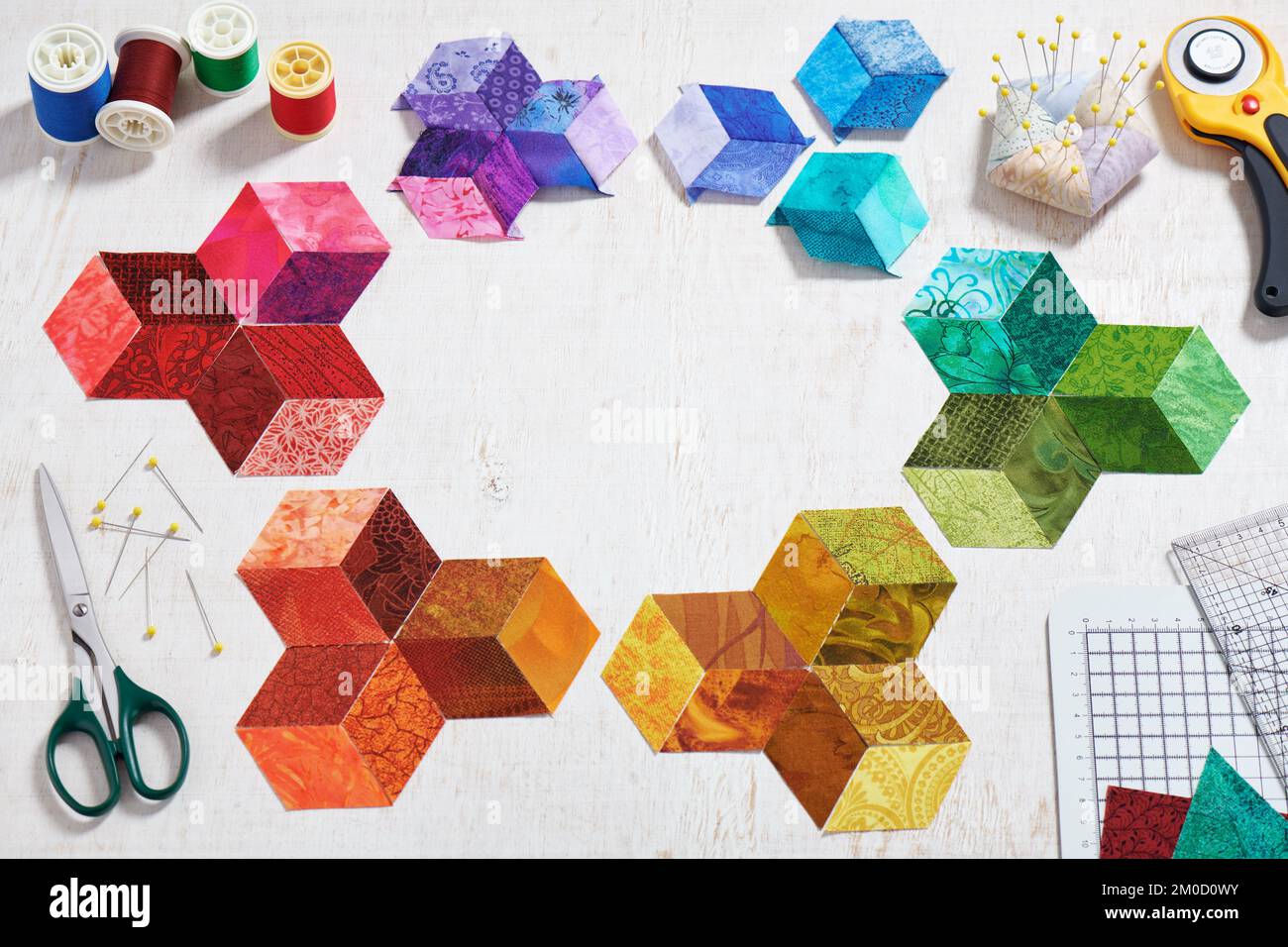 Preparing of bright diamond pieces of fabrics for sewing quilt, sewing ...