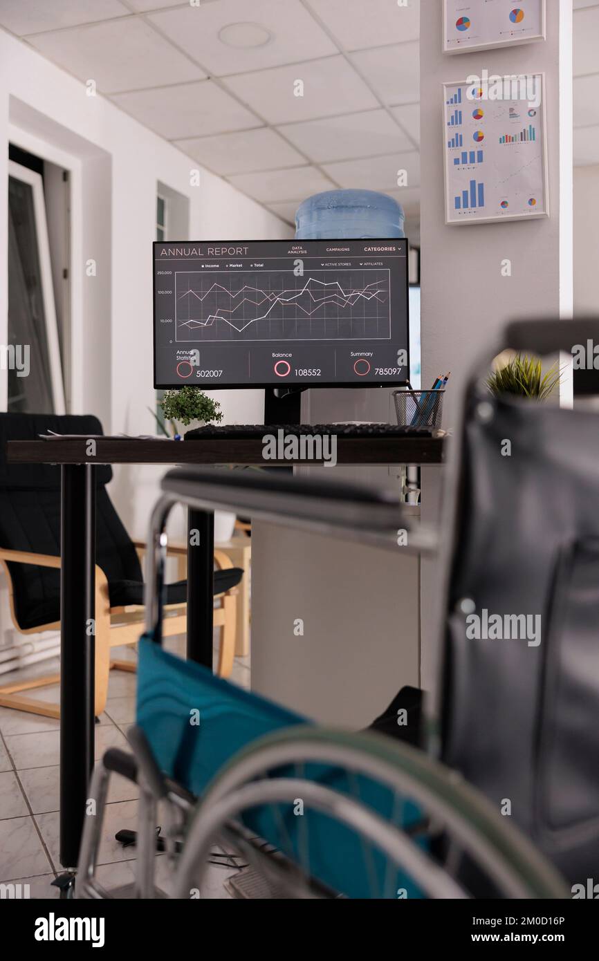 Empty office wheelchair accessible next to desk, company with policies ...