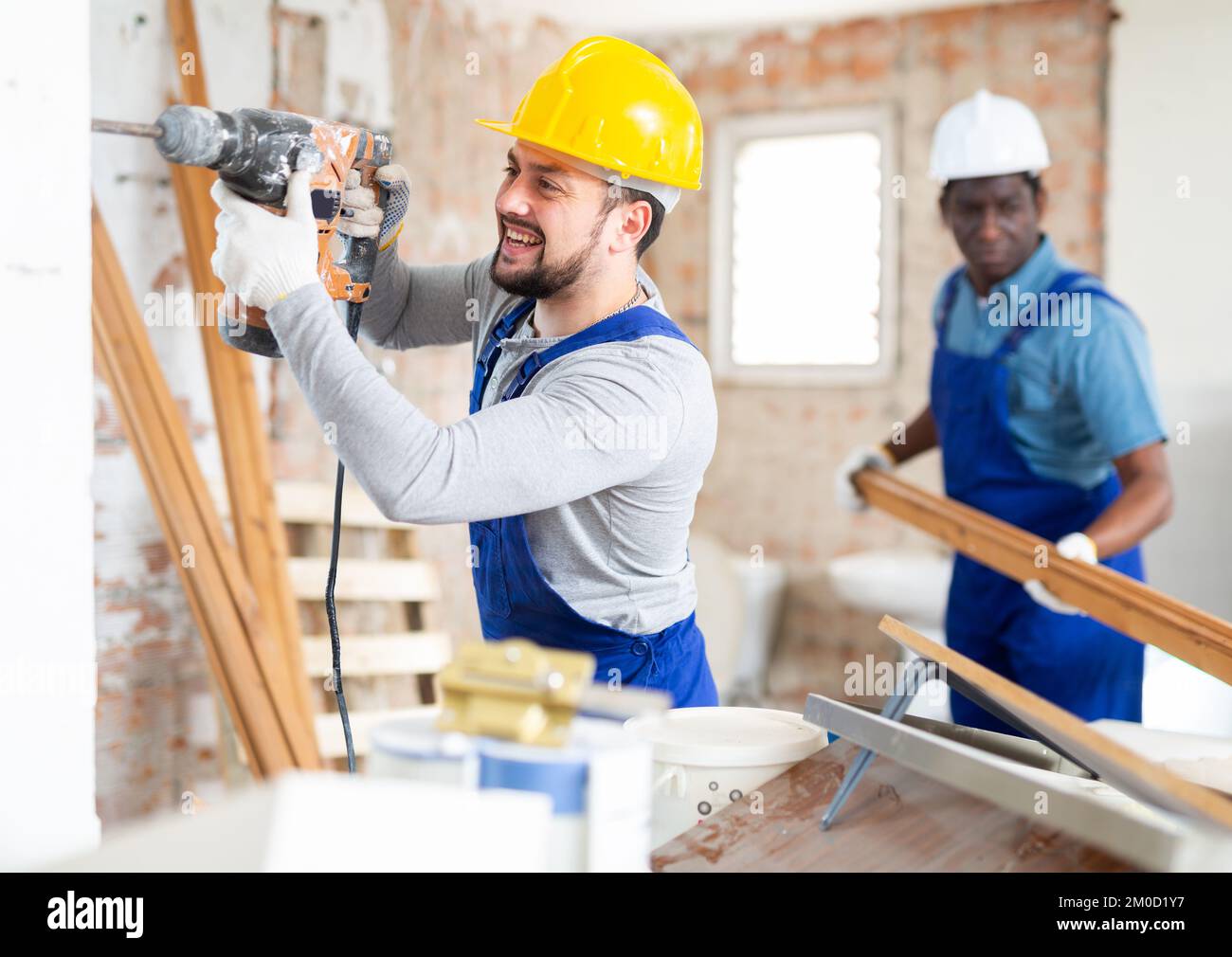 Builders on site holding hi-res stock photography and images - Alamy