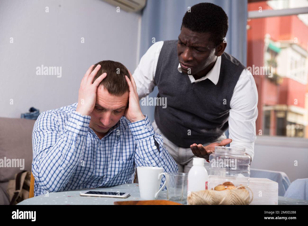 Man friends consoling hi-res stock photography and images - Alamy