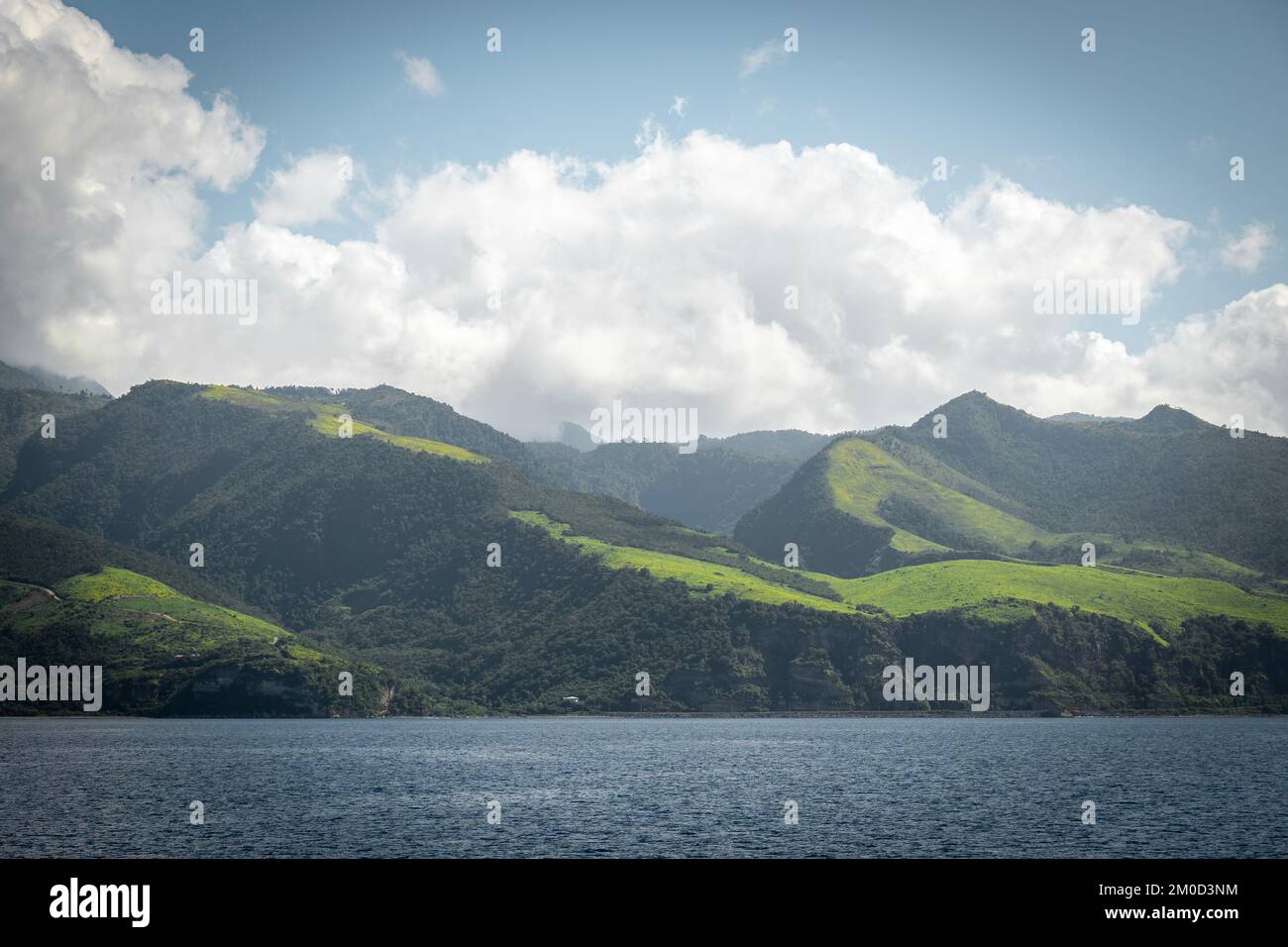 View of tree covered hills and mountains in Caribbeans. Rainforest land ...