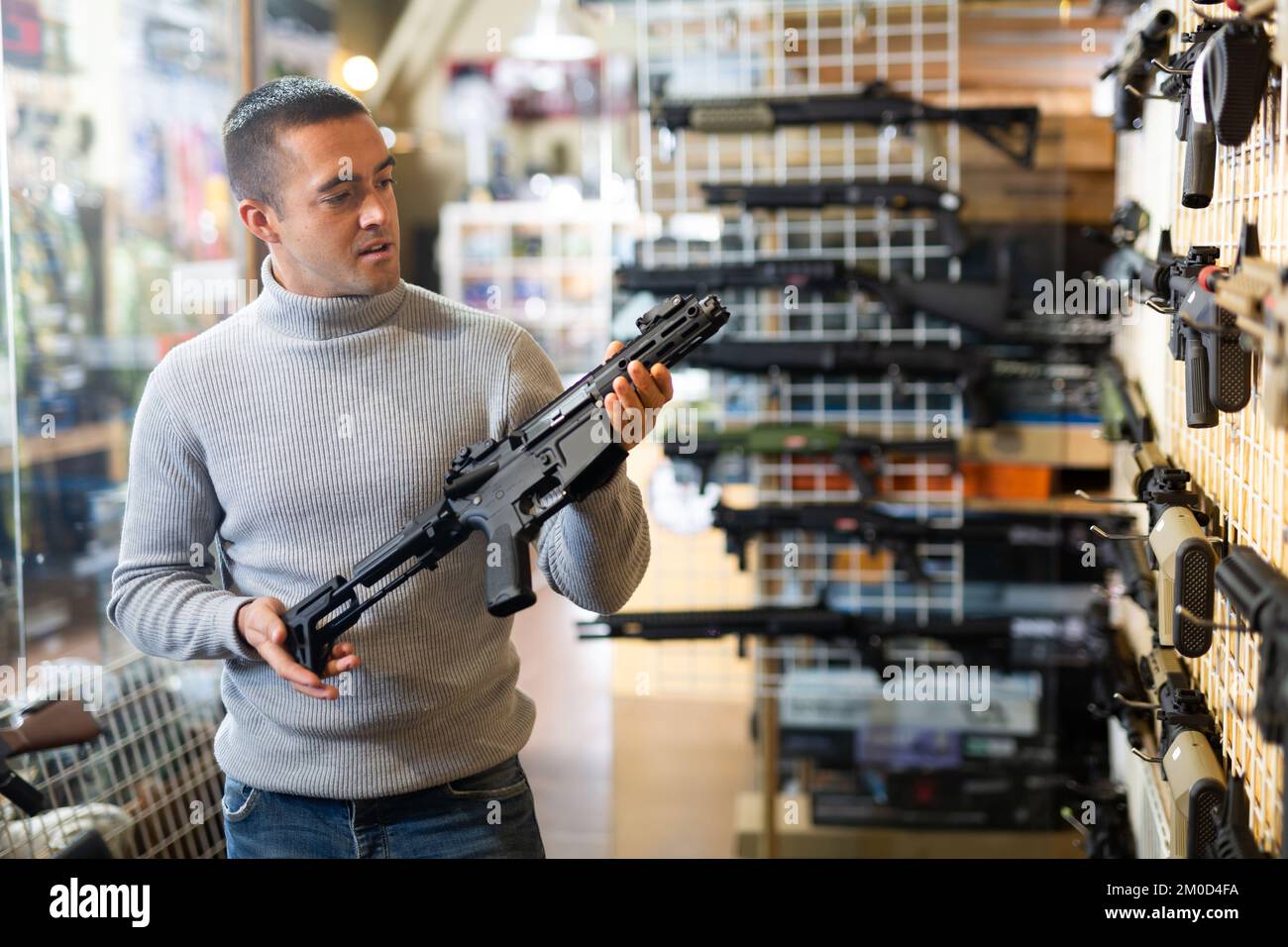 Man selecting machine gun hi-res stock photography and images - Alamy