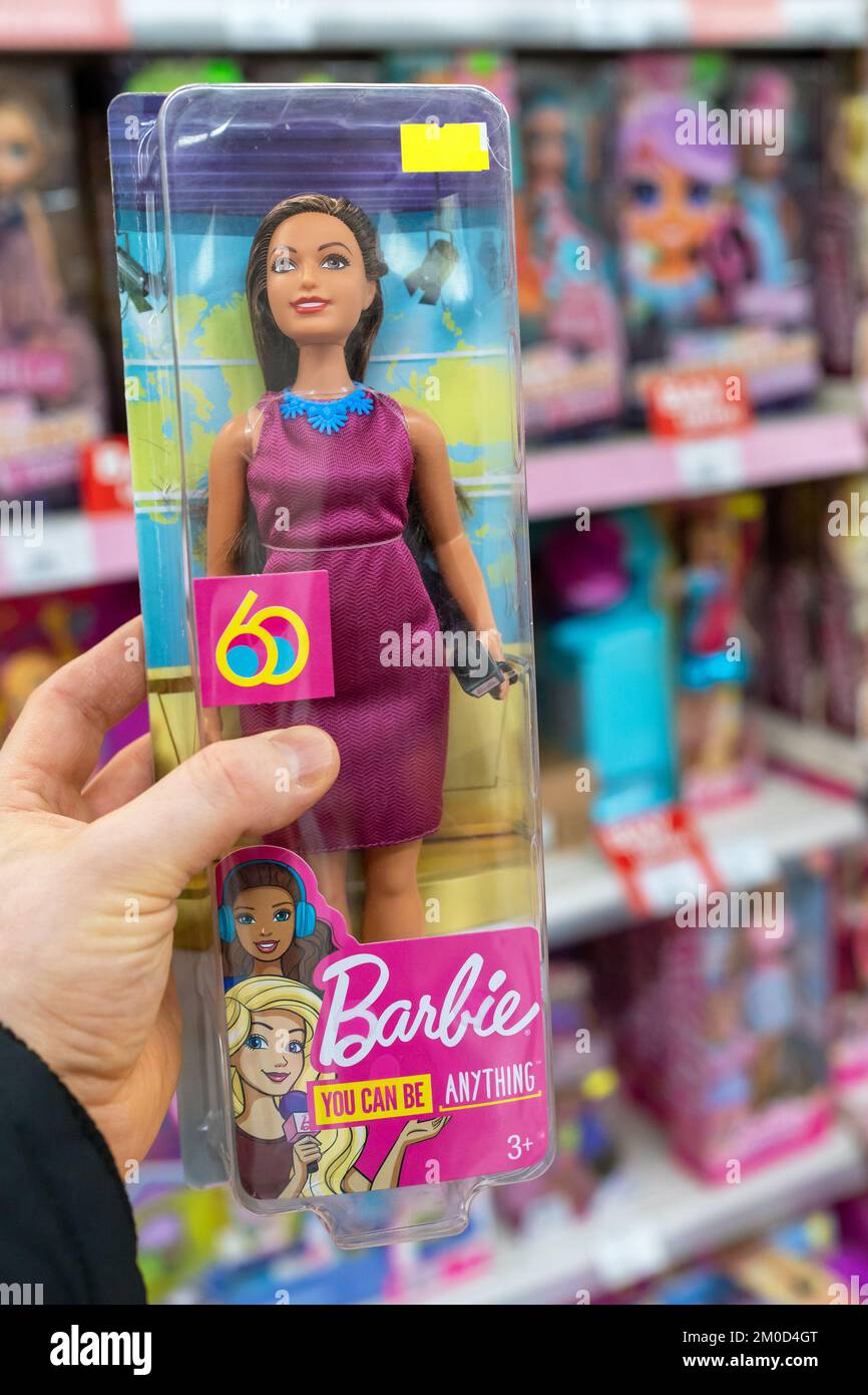 Barbie doll - a woman in her 60s, a TV presenter with a microphone in ...