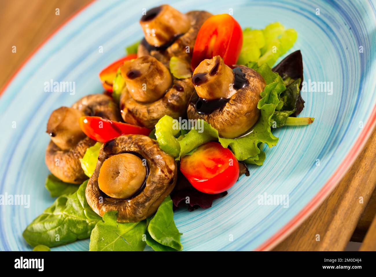 Baked mushrooms with greens and vegetables Stock Photo - Alamy