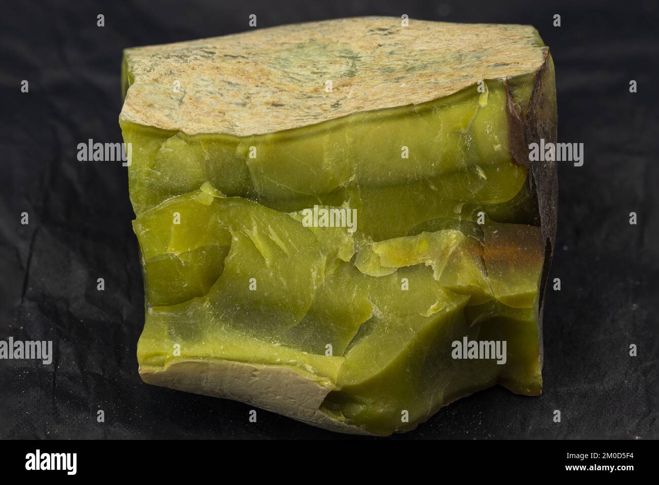 mineral specimen of green opal on a black background Stock Photo - Alamy