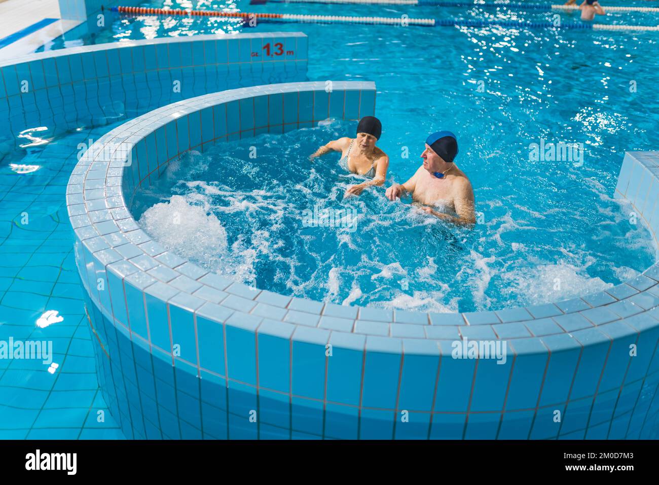 Variety of pool park swimming pools. Couple of caucasian pensioners or ...