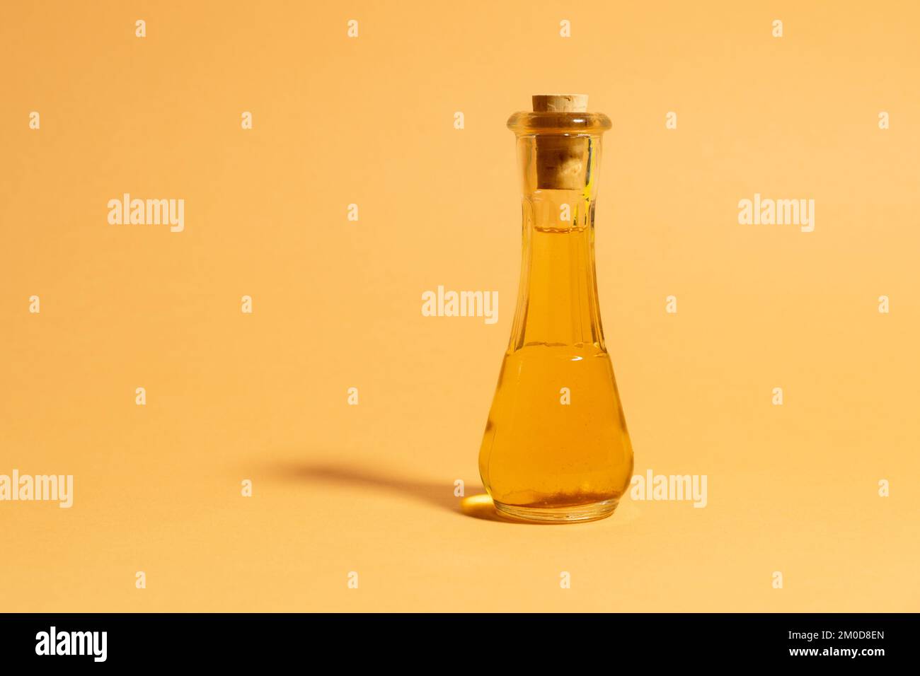 Sljivovica rakija in cokanj on bright orange background. Serbian ...