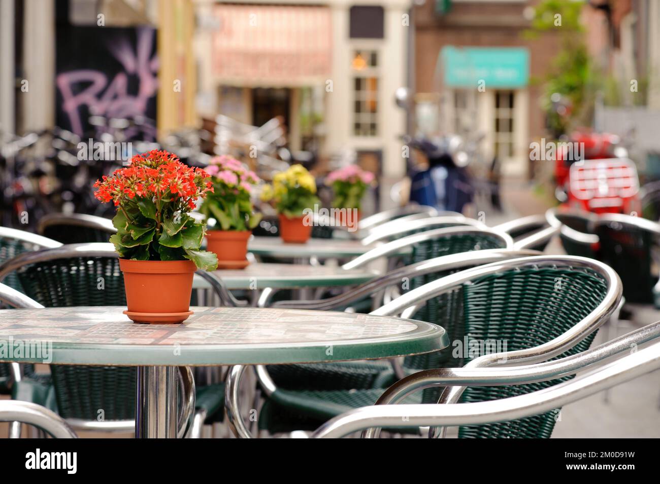 tables and chairs in outdoor cafe in Europe Stock Photo - Alamy