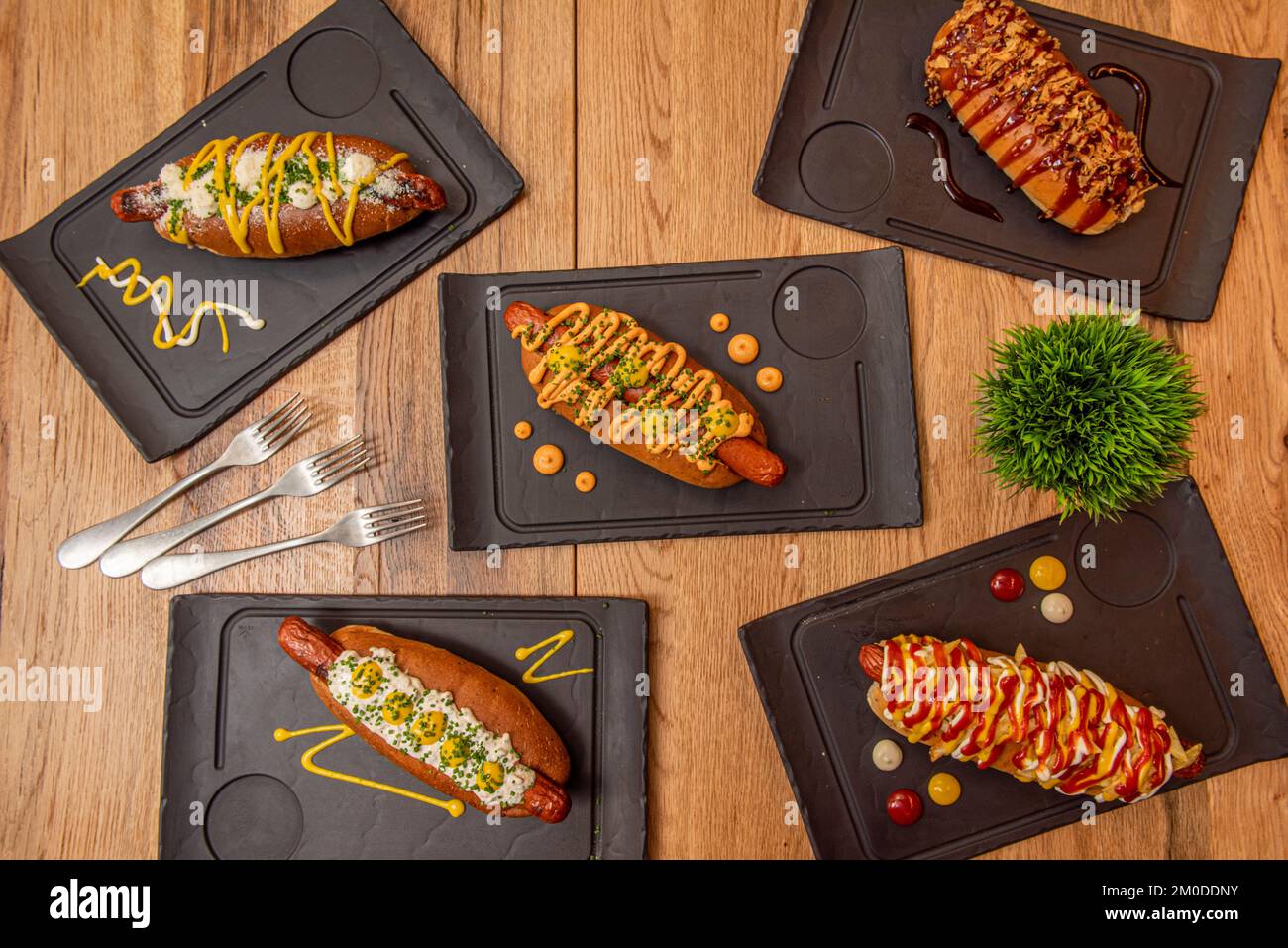 A table full of different hot dog recipes with sauces to taste Stock ...