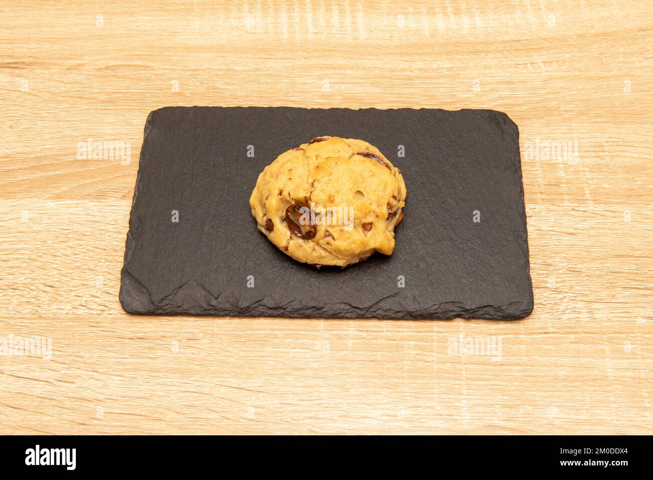 A light dough cookie filled with chocolate chips and pecans Stock Photo ...