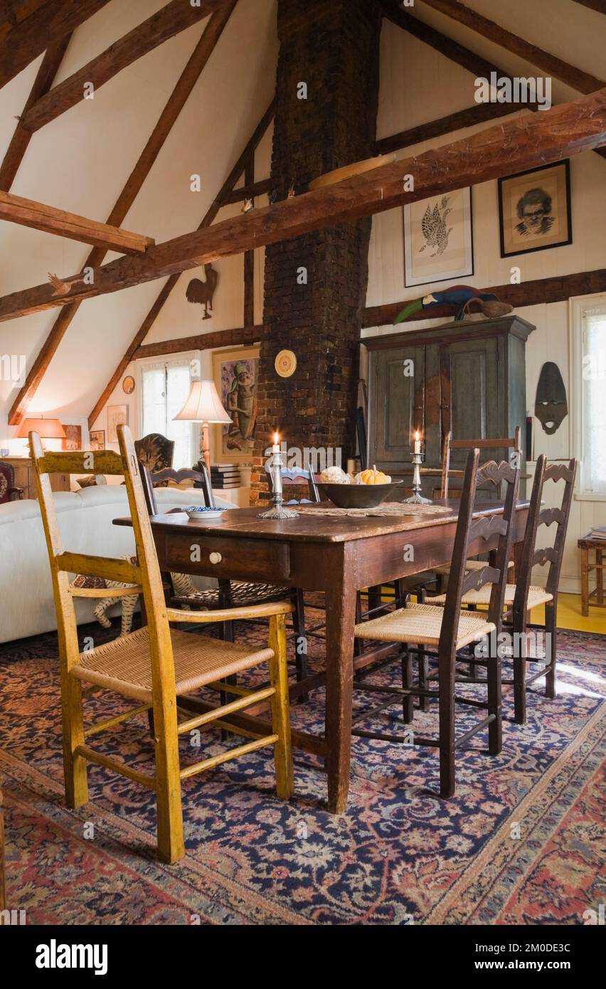 Antique table with high back chairs and furnishings in upstairs dining ...