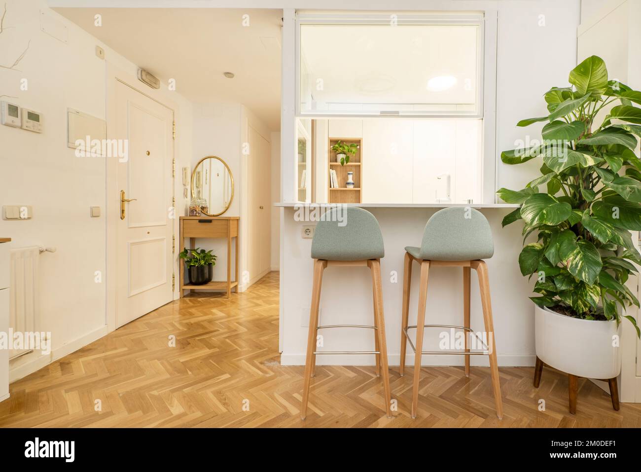 Living room and promenade area of a house with some wooden stools ...