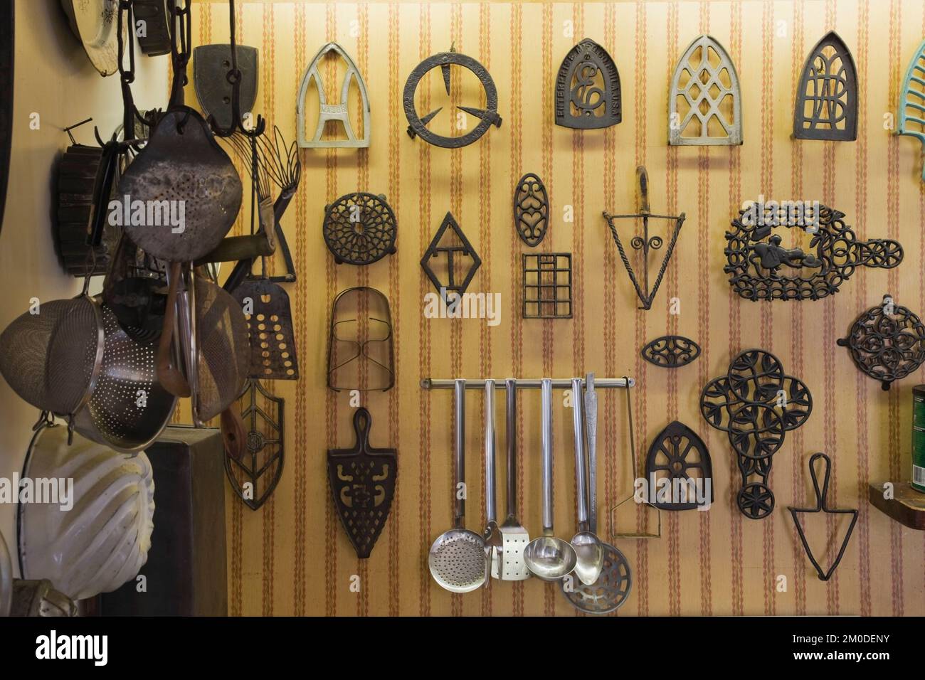 Cooking utensils on wall in kitchen inside old circa 1810 Canadiana ...