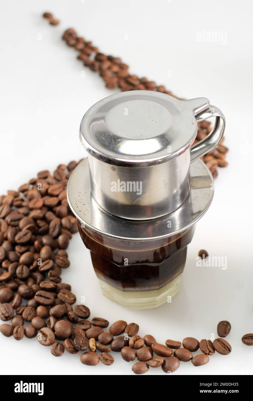 Coffee Dripping in Vietnamese Style on White Table with Coffee Bean ...
