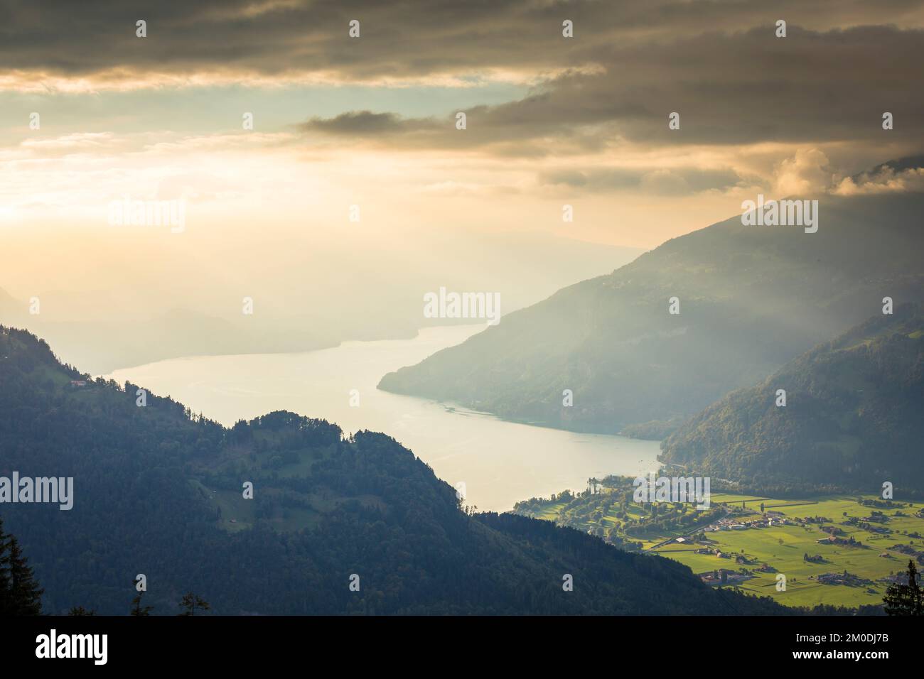 Aerial view of Swiss Alps and Lake Thun at dramatic sunset, Interlaken ...