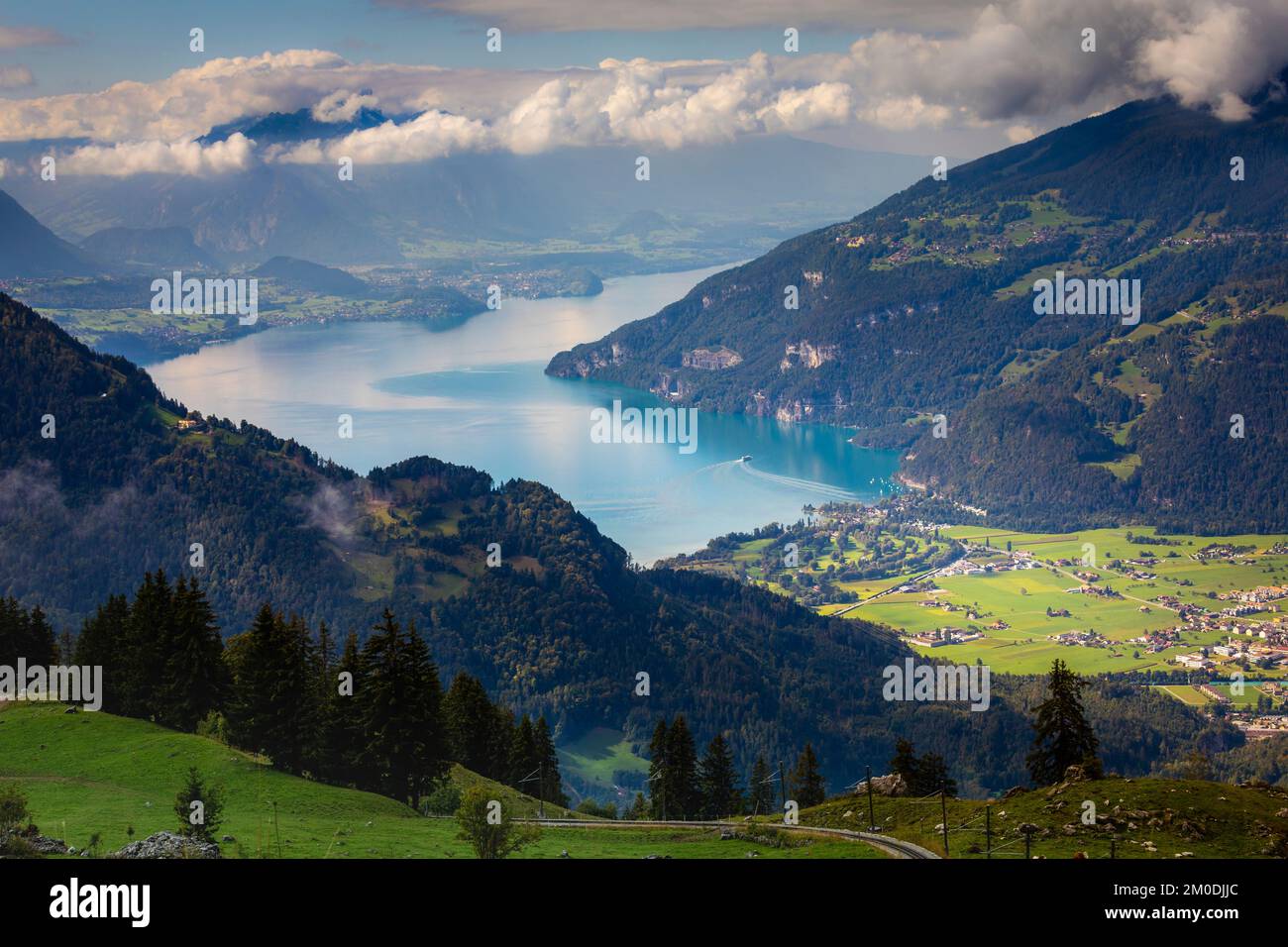 Aerial view of Swiss Alps and Lake Thun at dramatic sunset, Interlaken ...