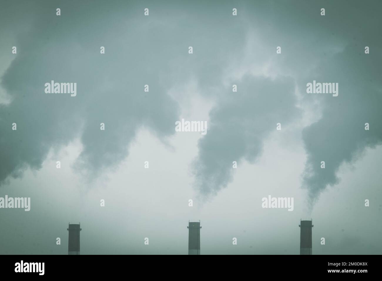 Cropped shot of coal power plant with steam pouring out of the stack ...